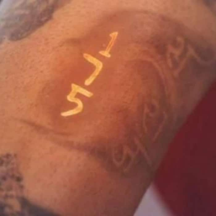 175 Number Tattoo on the left arm