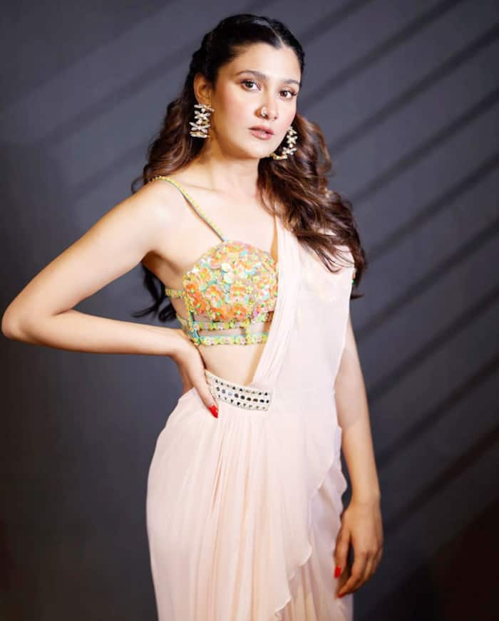 DJ Wale Babu Singer Aastha Gill is Breathtaking in a Peach Saree And Multi-Coloured Blouse