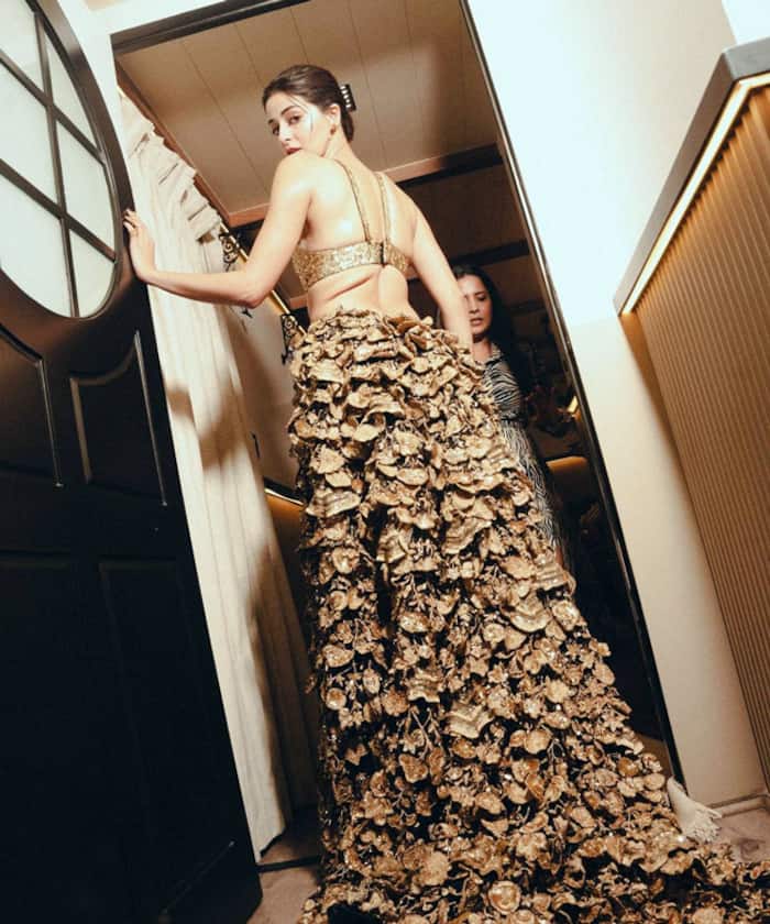 Ananya Panday Sizzles in Hot Golden Front-Open Dress at NMACC Gala l PHOTOS