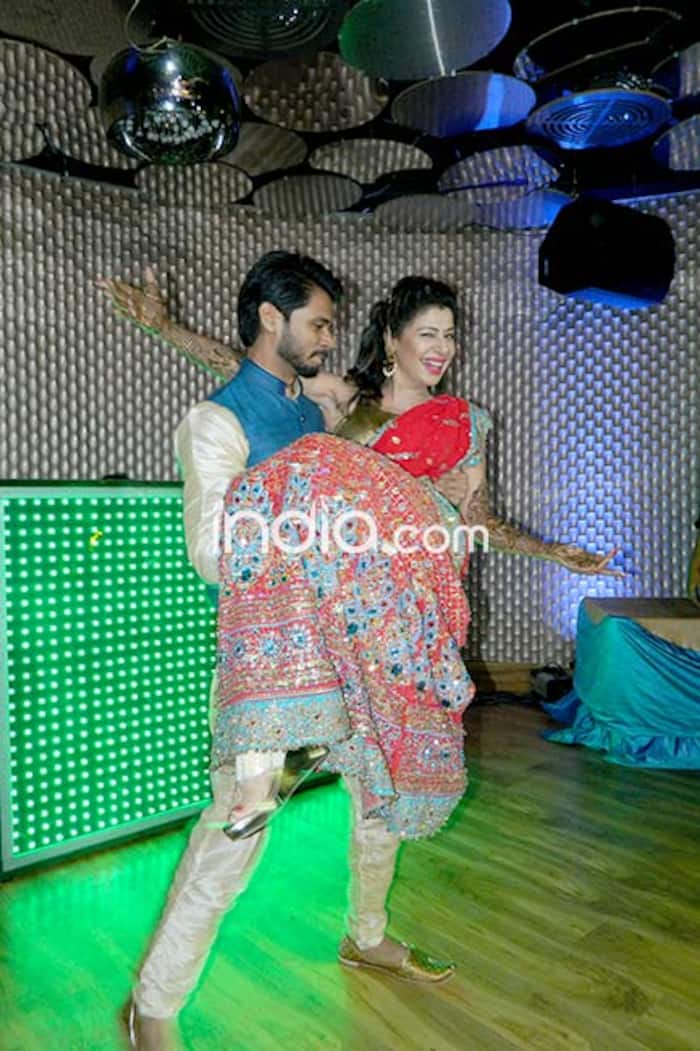 Sambhavna Seth poses on a tractor before her Mehendi ceremony