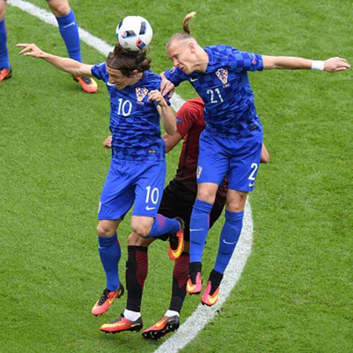 Turkey’s Oguzhan Ozyakup tackles Croatia’s Luka Modric during UEFA EURO ...