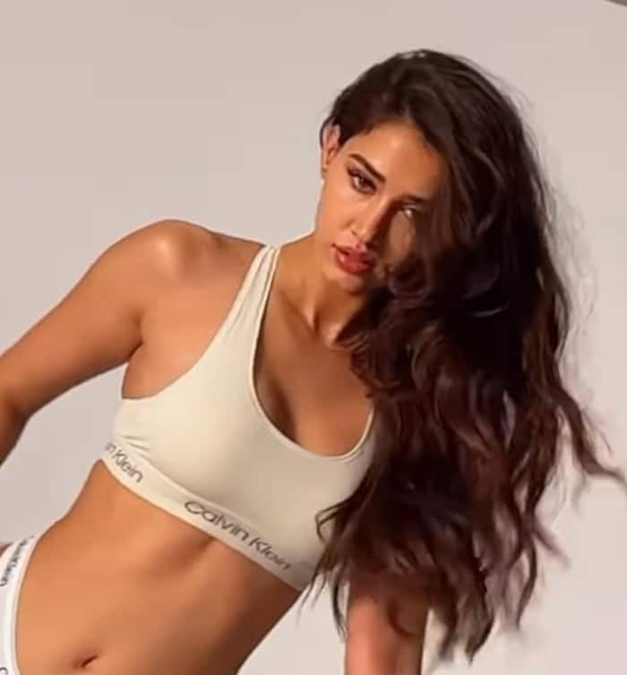 Disha Patani Stuns in Bold White Sports Bra And Matching Pants - See Hot Photos