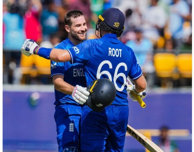 England batter Dawid Malan with Joe Root celebrating his century