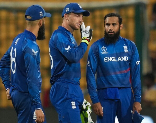 England's Moeen Ali, Jos Buttler and Adil Rashid discuss a point ...