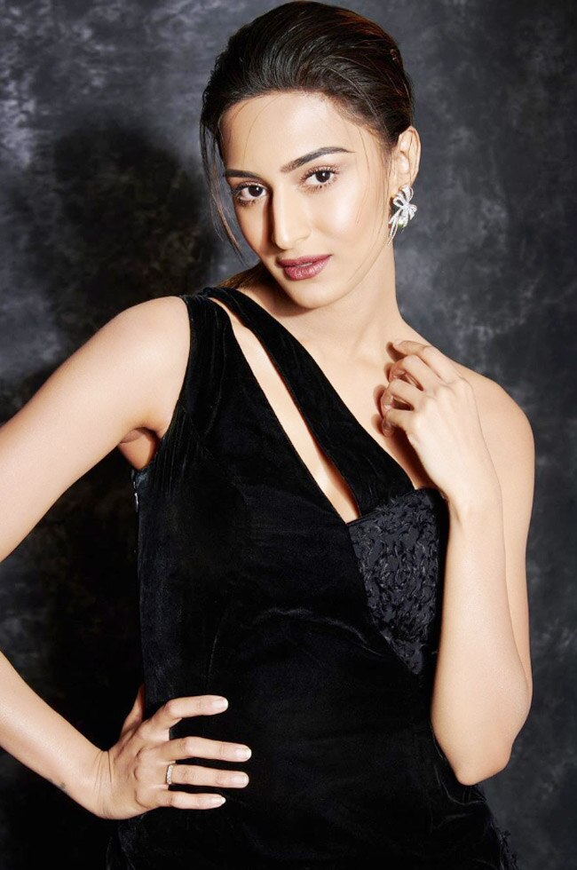 Erica looks drop dead gorgeous in a black sultry gown