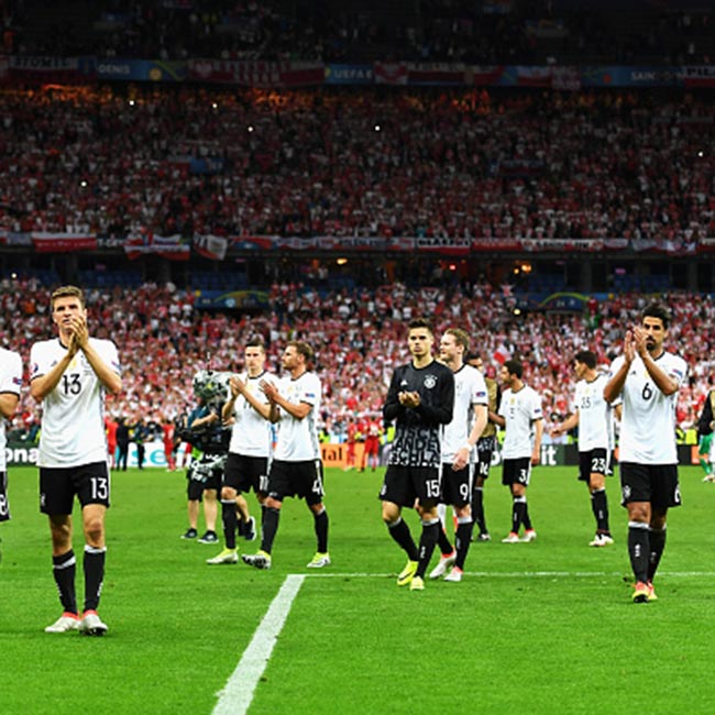 Germany’s Toni Kroos competes with Poland’s Kamil Glik during the UEFA ...