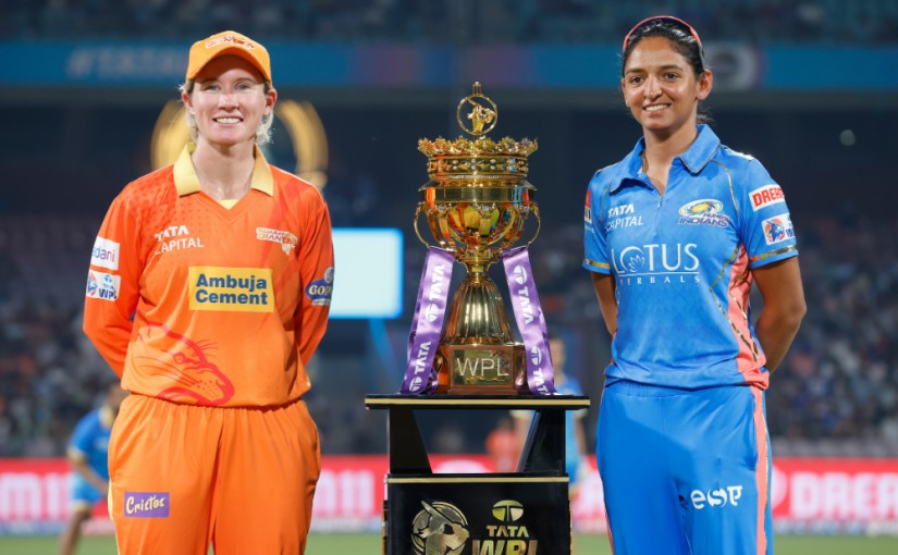 Harmanpreet Kaur and Beth Mooney (L) pose with the WPL trophy after the ...