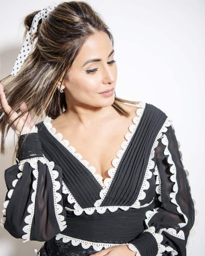 Hina Khan’s outfit features a plunging neckline in the front and back