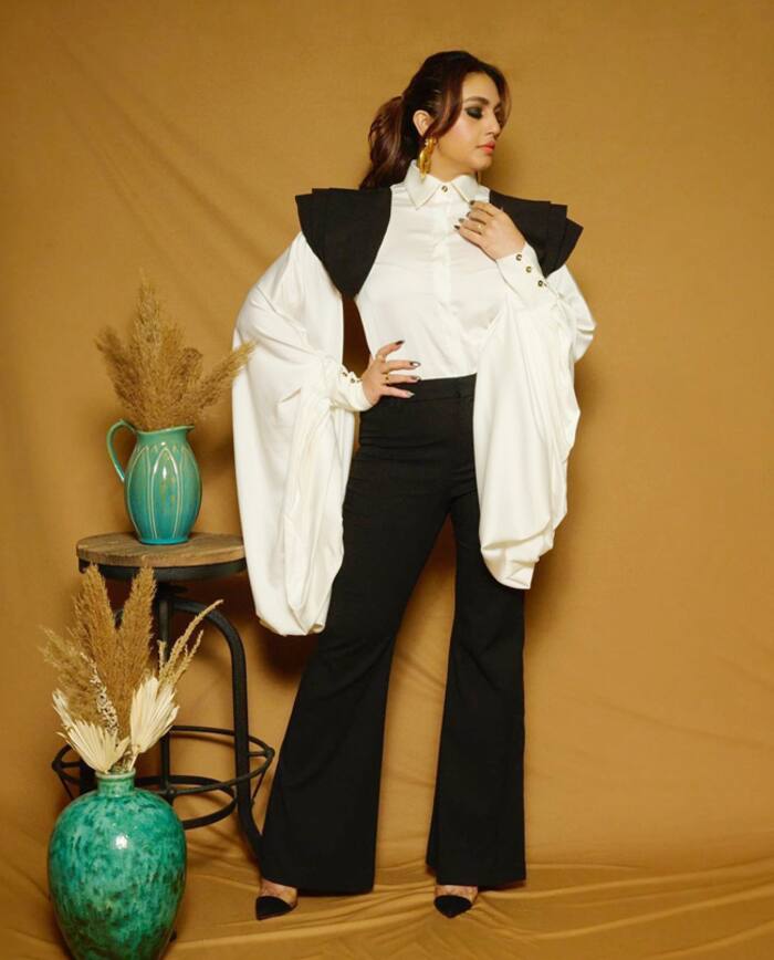 Huma Qureshi Stuns in White Silk Rosette Shirt And Black Trousers l PHOTOS