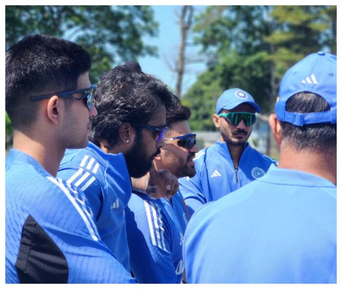 Indian players engage in a team huddle ahead of their first training ...