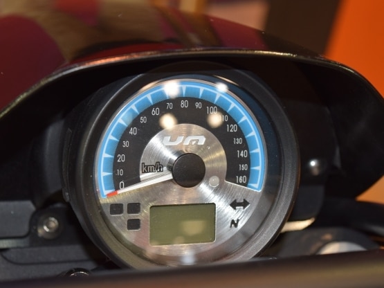 It has a matt black single exit exhaust muffler mounted at the side of ...