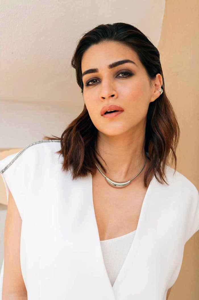 Kriti Sanon Stuns in Montones of White With Oversized Coat and Thigh-High Boots - See Pics - gallery