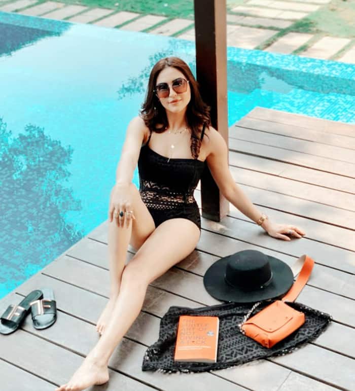 Krystle D’souza Goes Bold in Halter Neck White Bikini as She Takes a Dip in The Pool