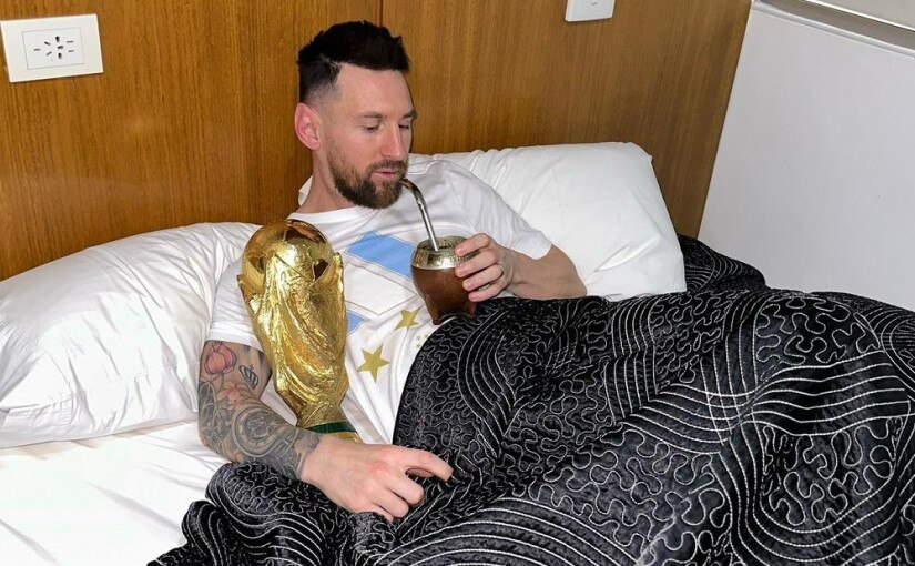 Lionel Messi wakes up embracing World Cup trophy.