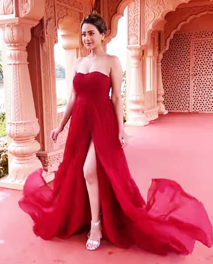 Madalsa Sharma Looks Burning Red Hot In Thigh High Slit Gown