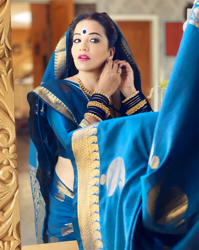 Monalisa in a blue banarasi saree is a vision