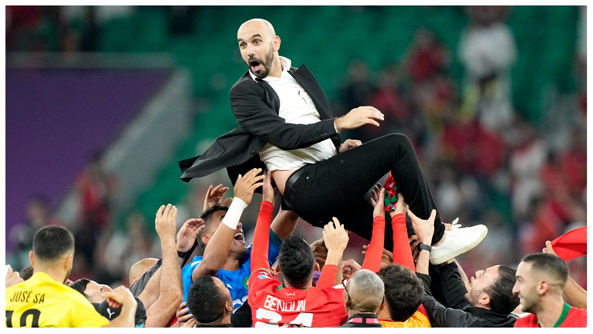 Morocco players celebrate their quarterfinal win over Portugal in FIFA ...