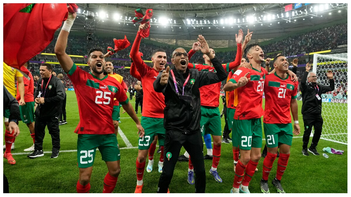 Morocco players celebrate their quarterfinal win over Portugal in FIFA ...