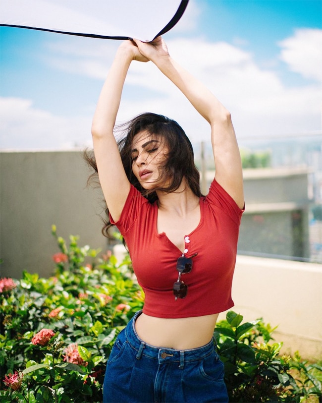 Mouni Roy Looks Effortlessly Amazing in Red Crop Top and Blue Denim ...