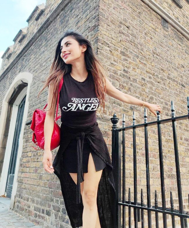 Mouni Roy poses with her red bag in this cute picture