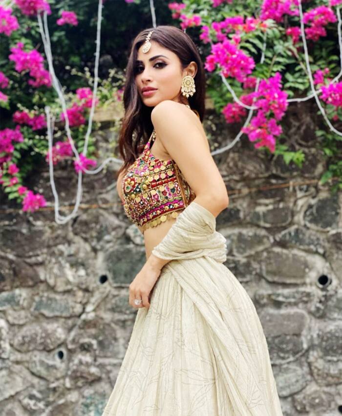 Mouni Roy Looks Gorgeous In A Off-White Lehenga and Multi-coloured Choli