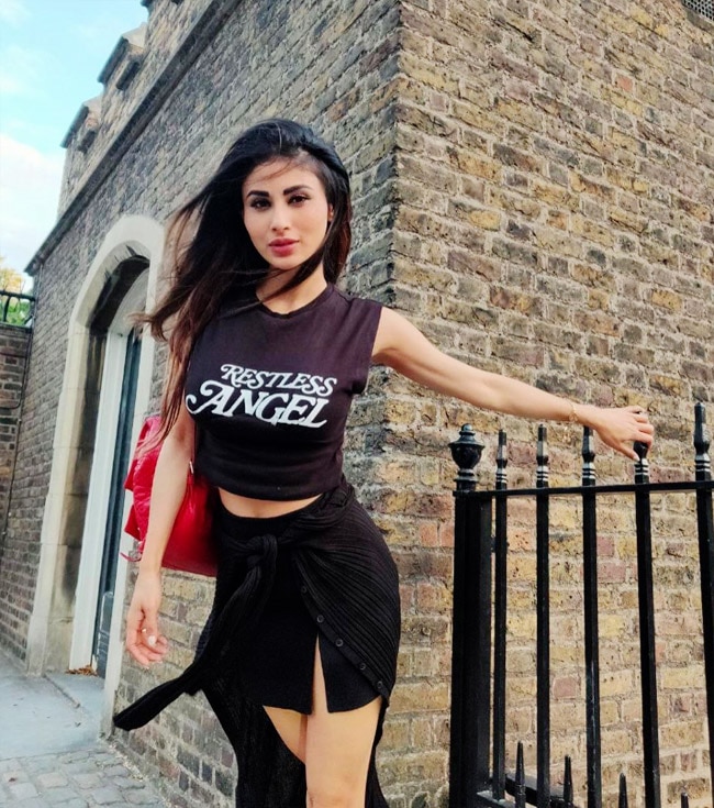 Mouni Roy poses with her red bag in this cute picture