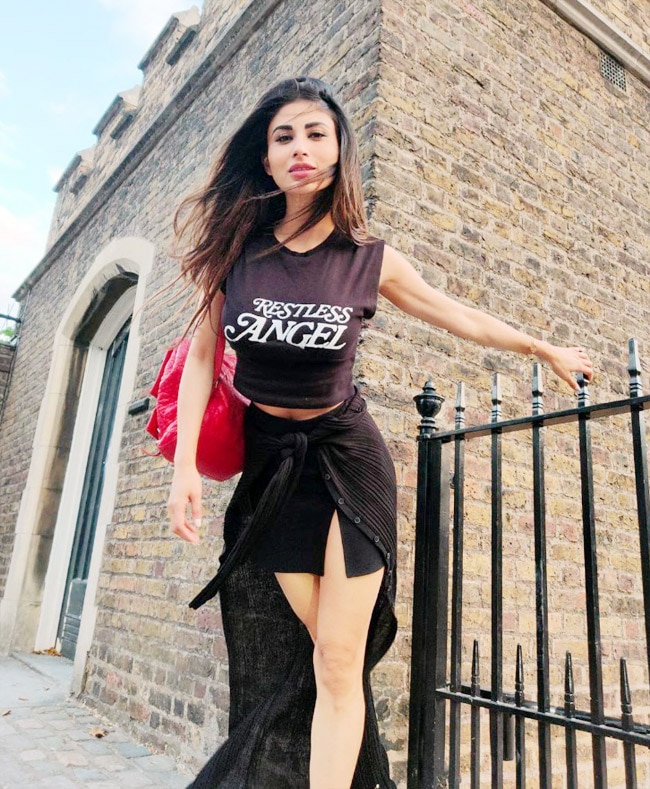 Mouni Roy poses with her red bag in this cute picture