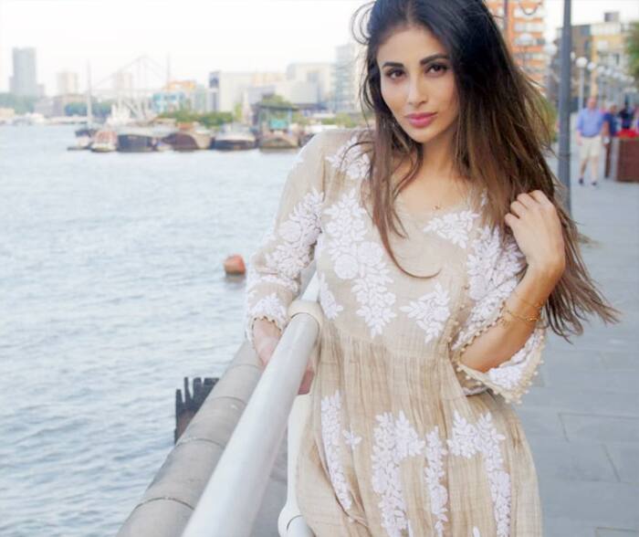 Mouni Roy Poses Near The Fountain in All Black Dress, Floral Jacket And ...