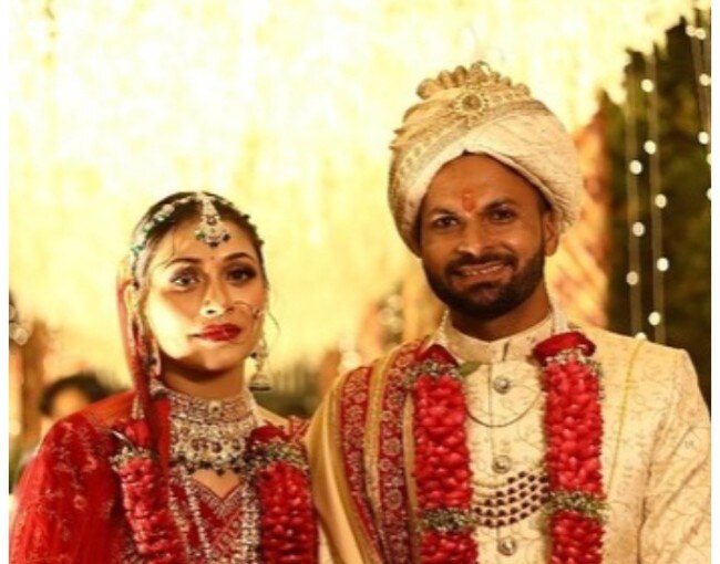 Mukesh Kumar and Divya Singh pose for a picture after their wedding.