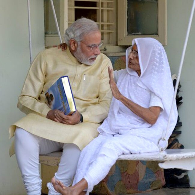 Narendra Modi touching mother’s feet