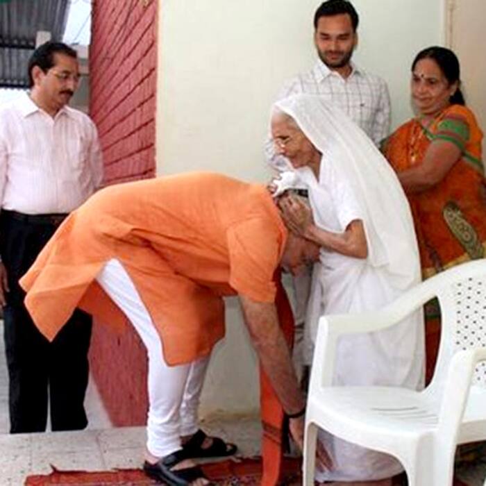 Narendra Modi touching mother’s feet