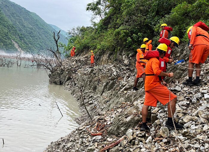 NDRF team conduct search and rescue operations in the affected Sunni area after the catastrophic ...