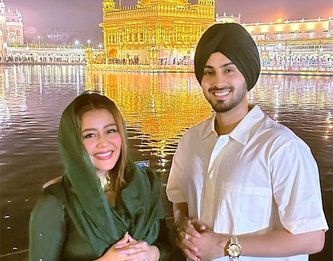Neha Kakkar and Rohanpreet Singh twin in green as they pay divine visit ...