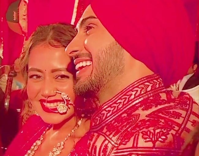 Neha Kakkar slays in a red bridal lehenga in Delhi