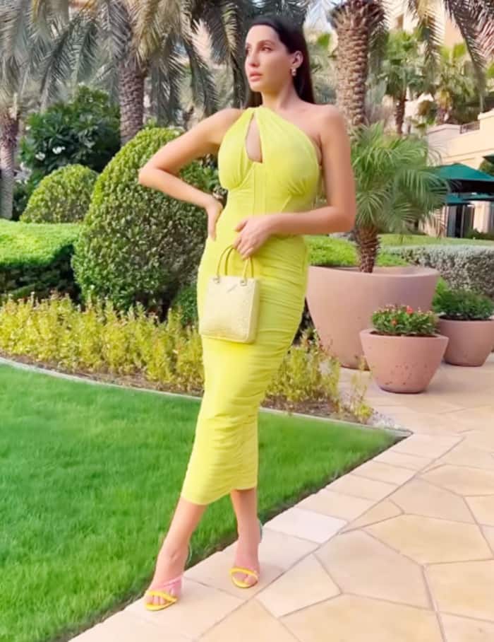 Nora Fatehi Flaunts Her Svelte Figure In A Body-Hugging Neon Dress With ...