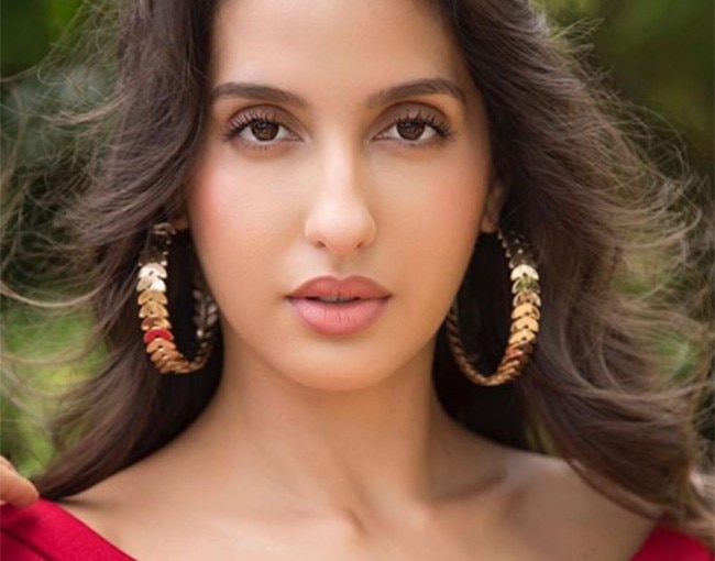 Nora Fatehi Sizzles in Red Ensemble