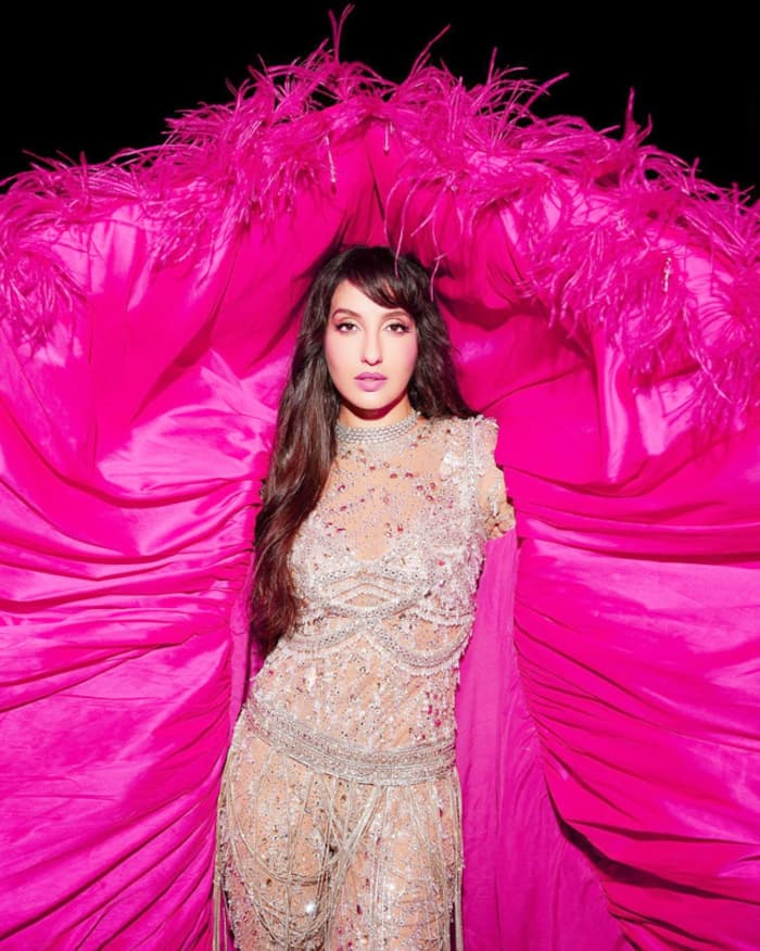 Nora Fatehi rocks her FIFA fanfest look in a nude jumpsuit and giant ...