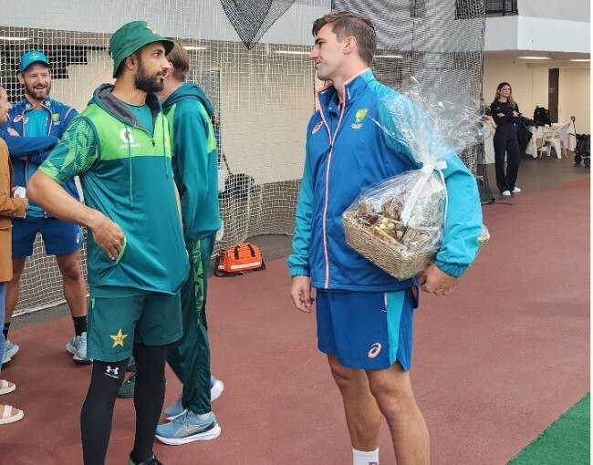 Pakistan captain Shan Masood and Australian skipper Pat Cummins chat at ...