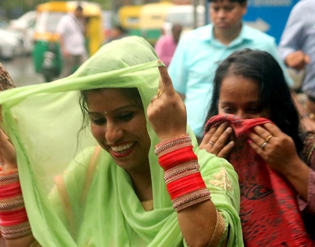 People in Delhi enjoying cool weather