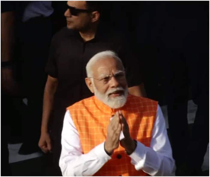 In PICS: PM Modi Votes In Ahmedabad, Signs His Portrait While ...