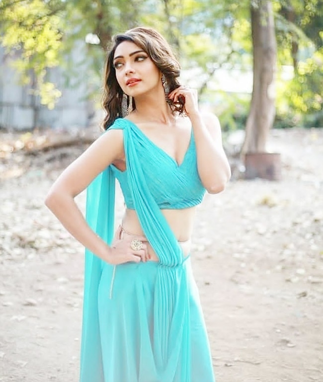 Pooja Banerjee Goes Sultry in Golden Sparkling Dress