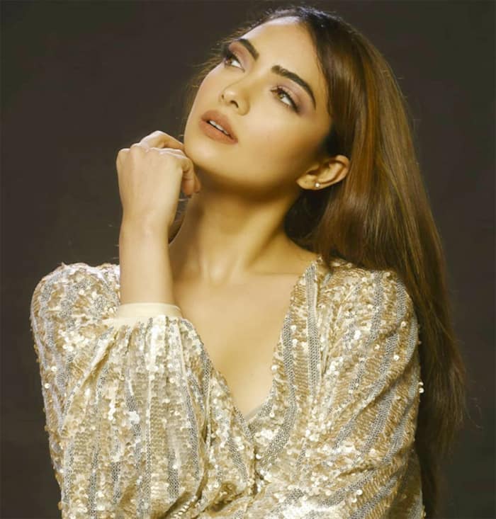 Pooja Banerjee Goes Sultry in Golden Sparkling Dress
