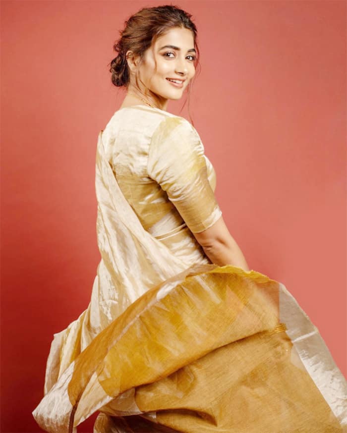 Pooja Hegde Smiles, Sparkles, And Shines in Golden Saree - See ...