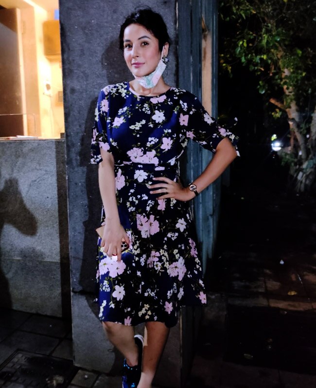 Shehnaaz Gill is wearing a Black outfit with dramatic sleeves