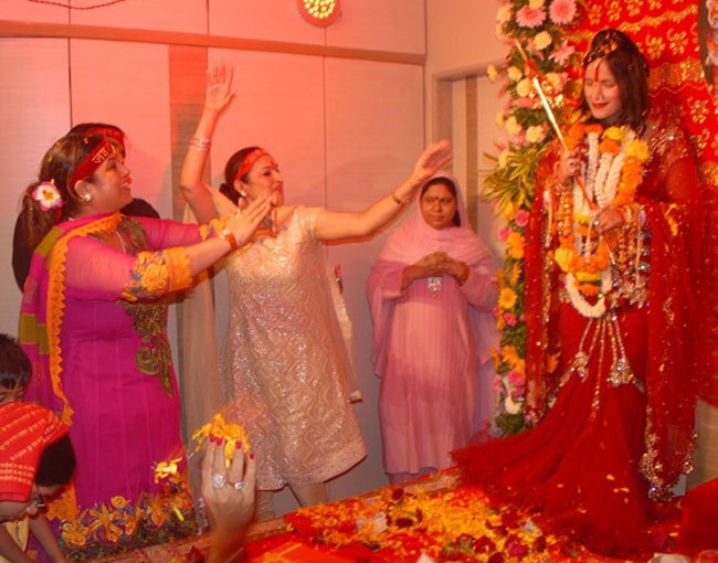 Radhe Maa being worshipped by her devotees