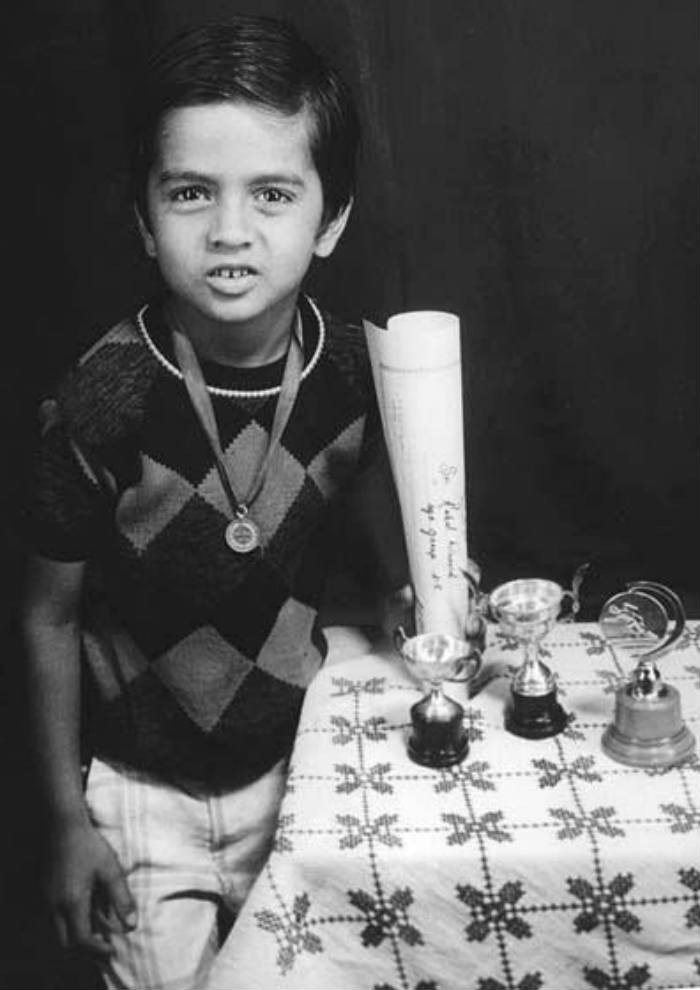 Rahul Dravid posing for the cameras in his cricket dress when he was young