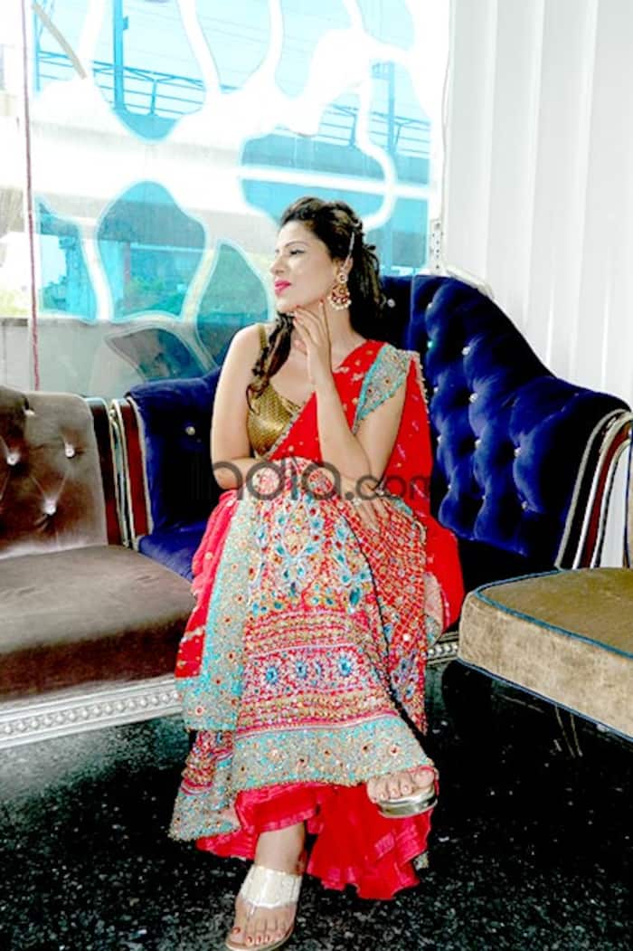 Sambhavna Seth poses on a tractor before her Mehendi ceremony