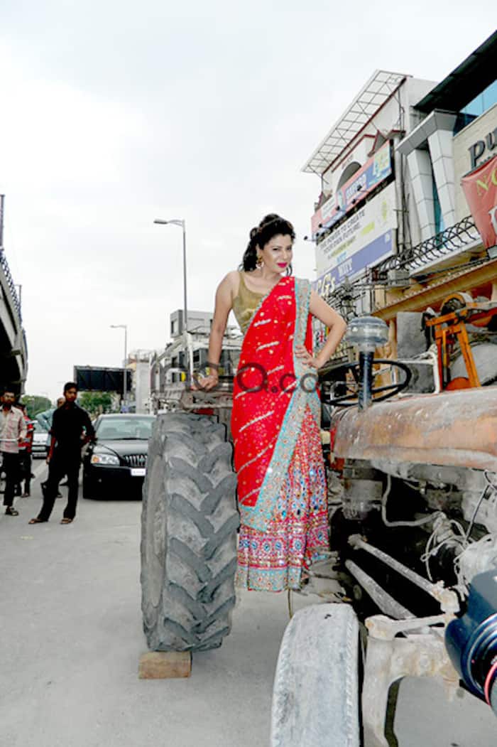 Sambhavna Seth poses on a tractor before her Mehendi ceremony