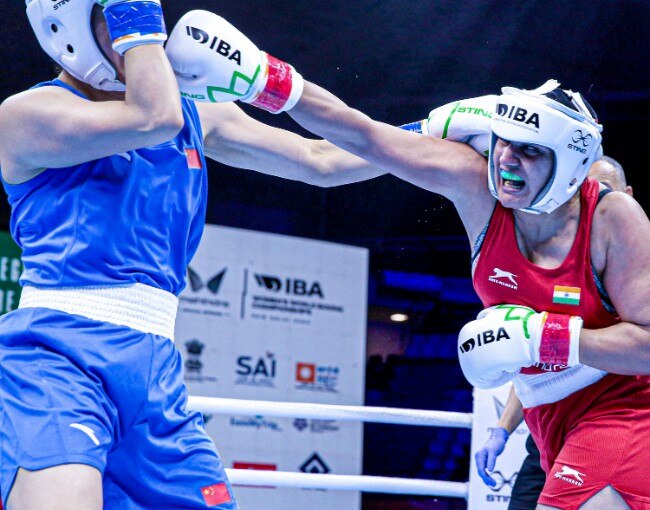 Saweety Boora lands a punch on her opponent during the World ...