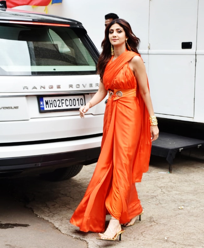 Shilpa Shetty goes bold and beautiful in an orange saree gown